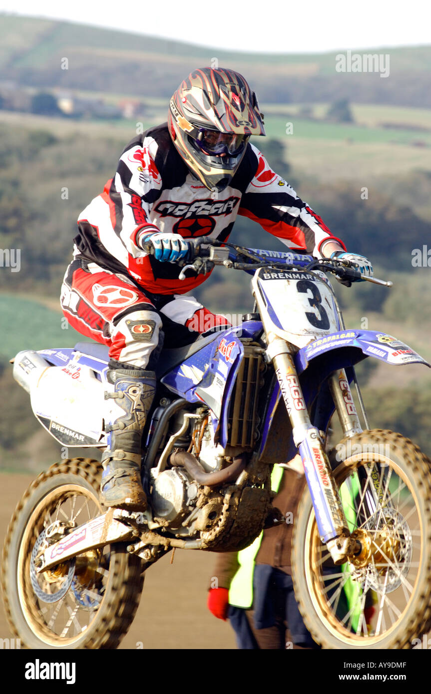 a guy rider on a motocross bile motorcycle jumping and racing big air ...