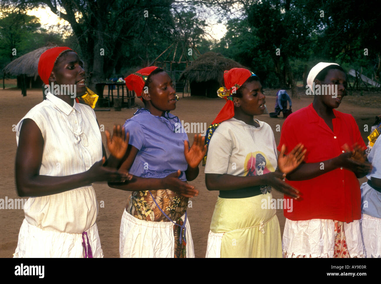 4, four, Zimbabwean women, African women, singing, hand-clapping, hand ...