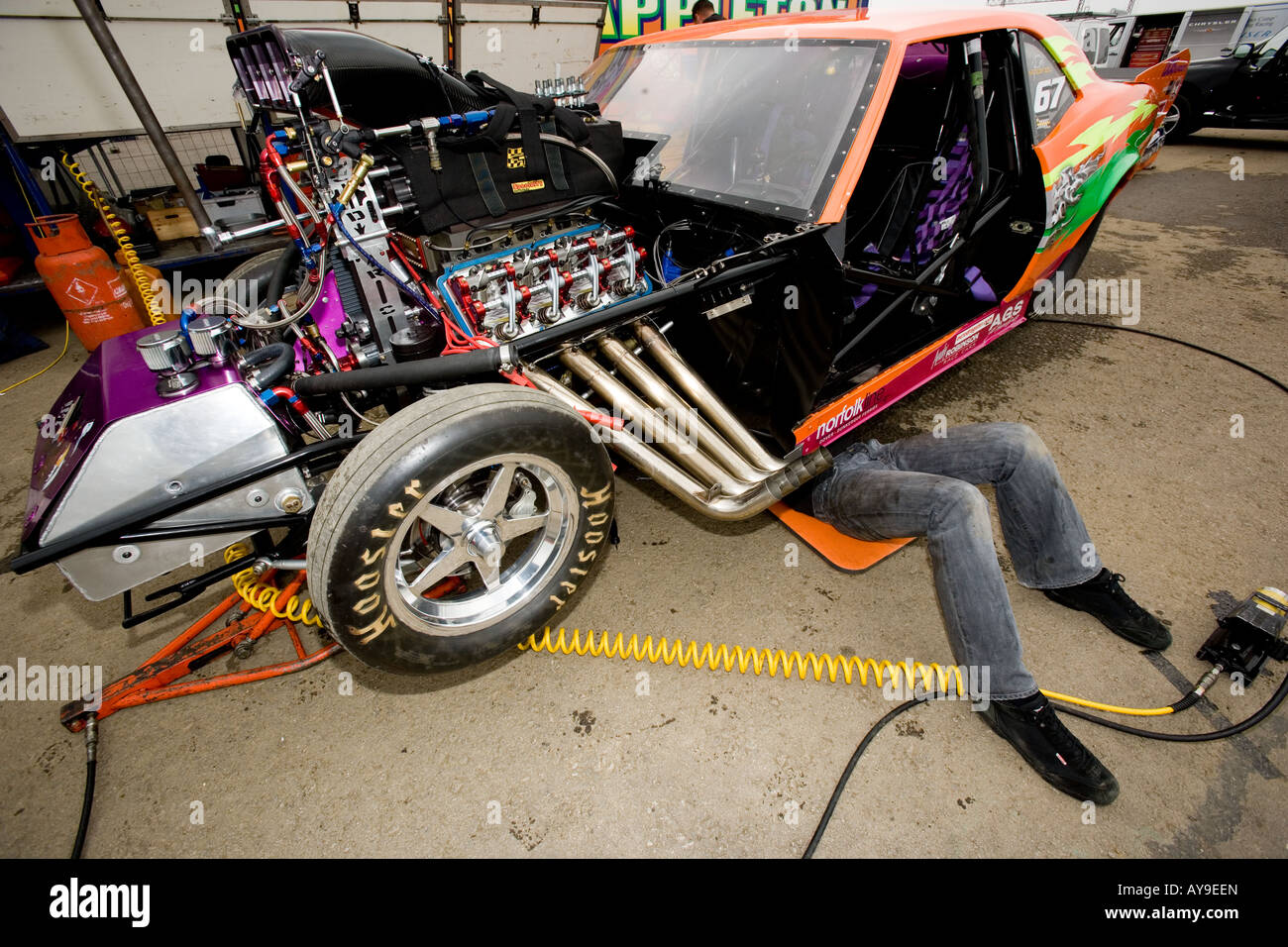 Mechanic working on dragster racing car at Santa Pod, UK Stock Photo ...