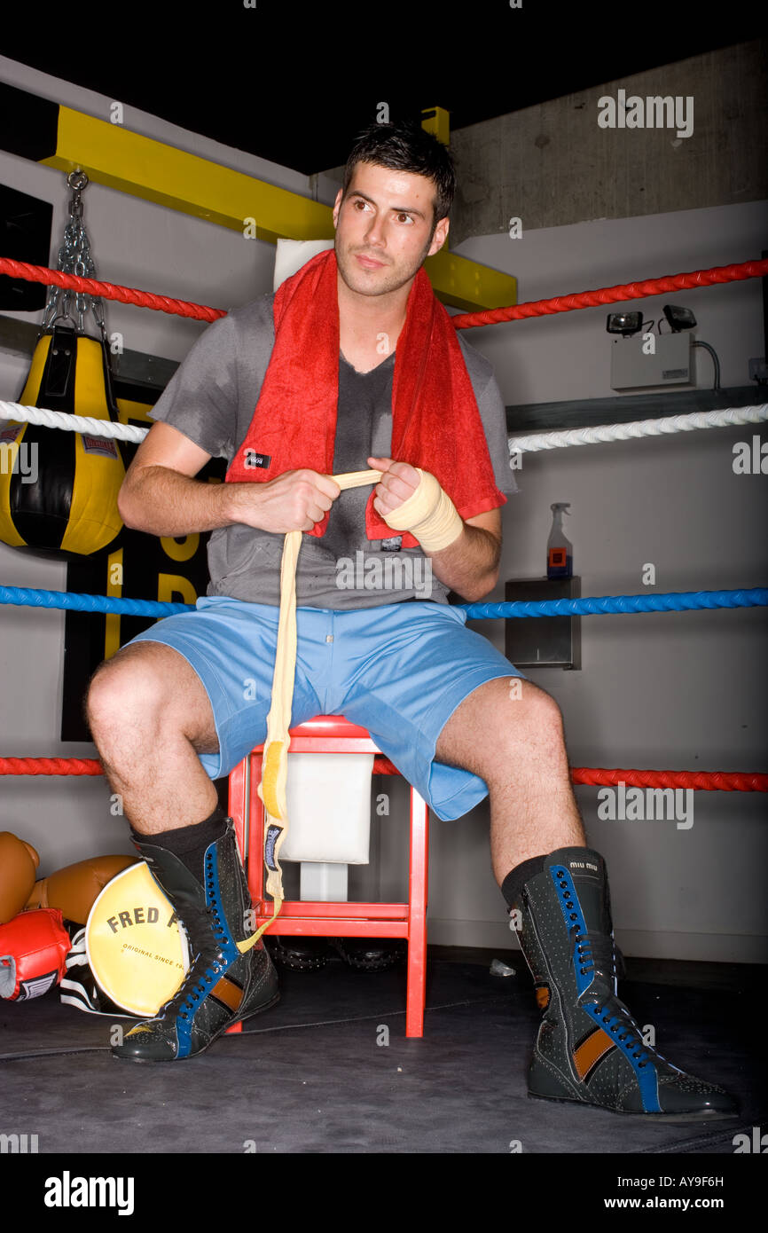 Boxer taping hands in boxing ring Stock Photo - Alamy