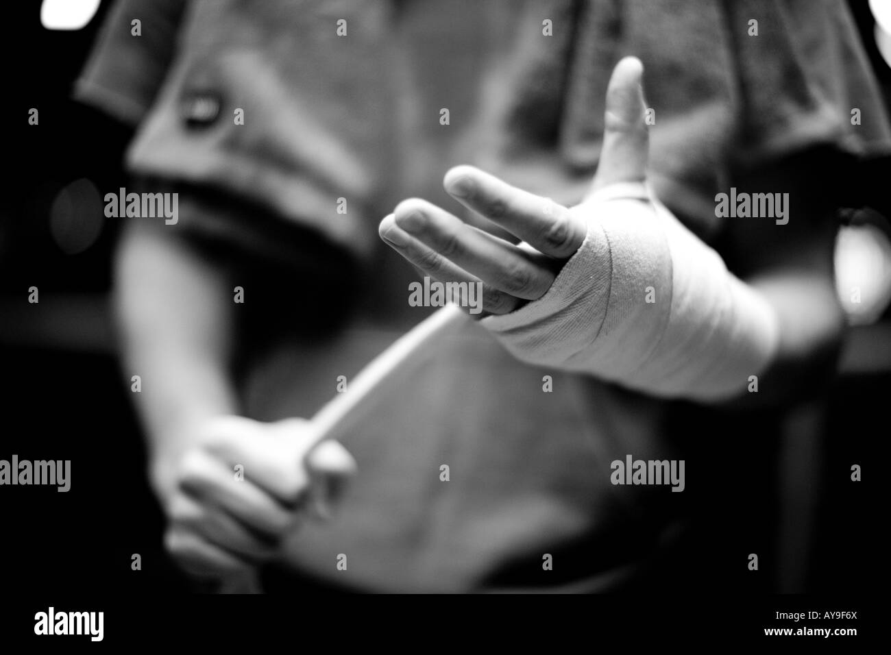 Boxer taping hands in preparation Stock Photo - Alamy