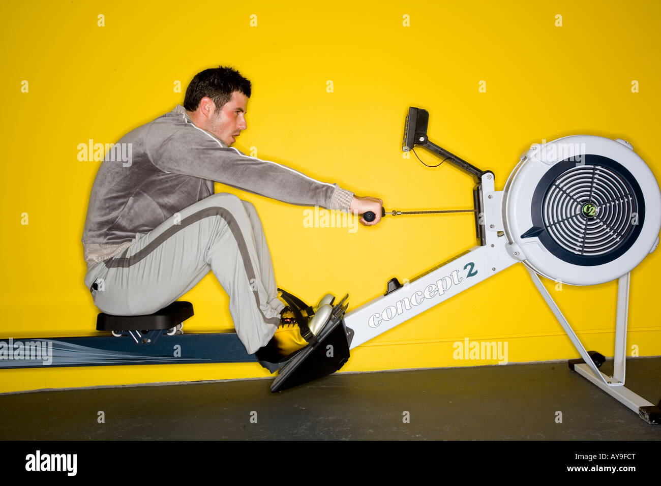 Man on a rowing machine hi-res stock photography and images - Alamy