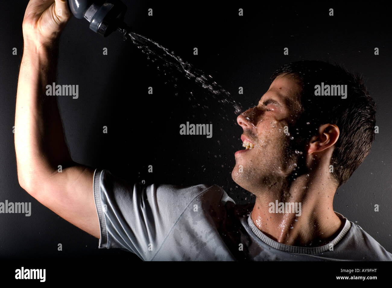 Man splashing water on his face, rehydration Stock Photo - Alamy
