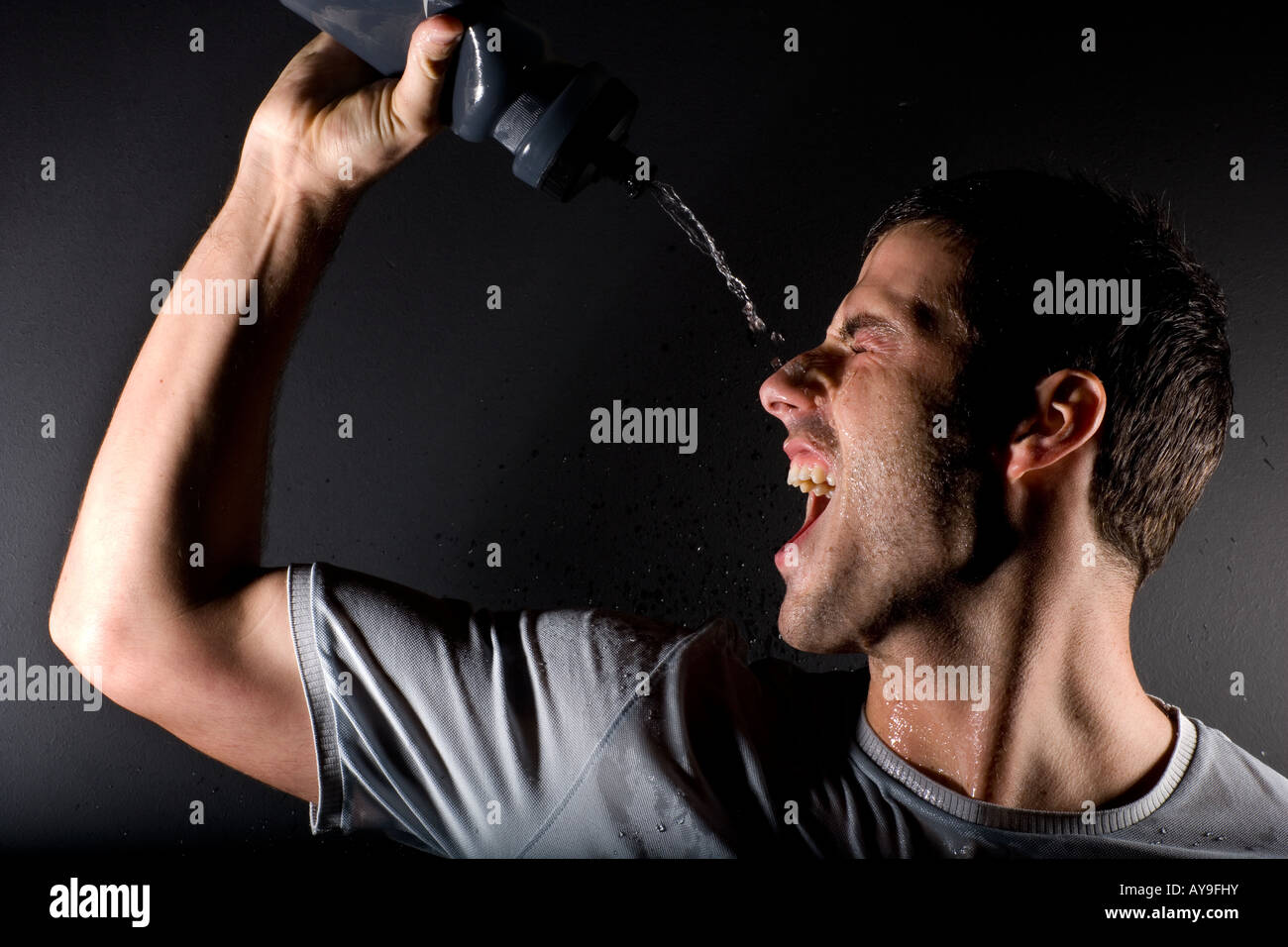 Man splashing water on his face, rehydration Stock Photo - Alamy
