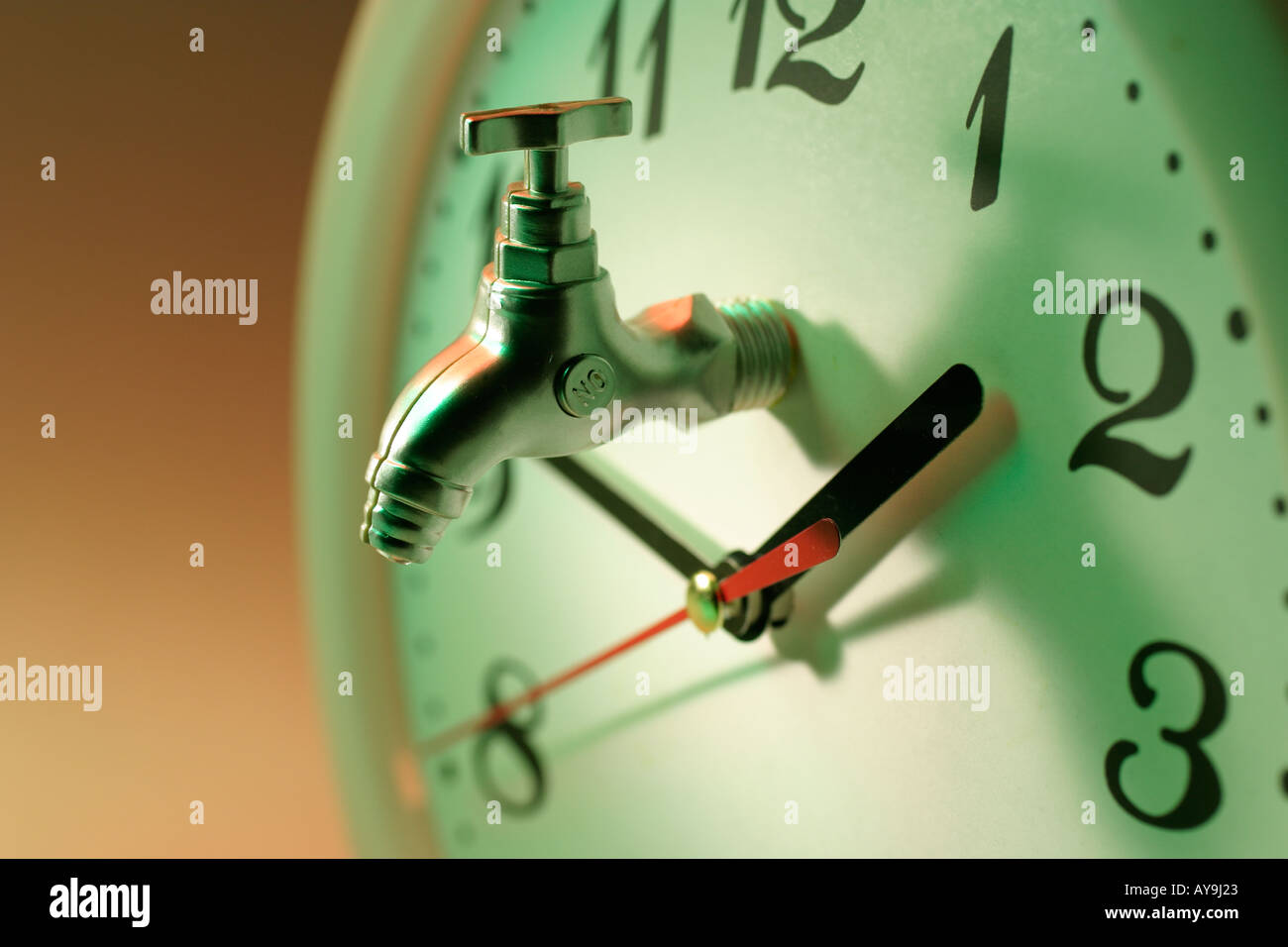 Tap on Clock Stock Photo - Alamy