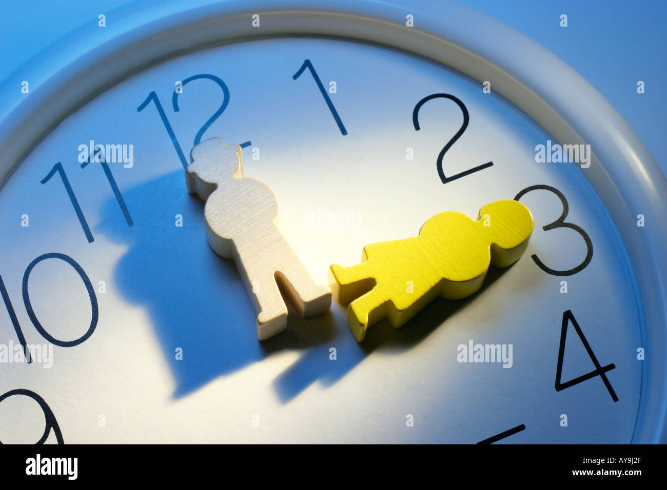 Wooden Figures on Clock Stock Photo - Alamy