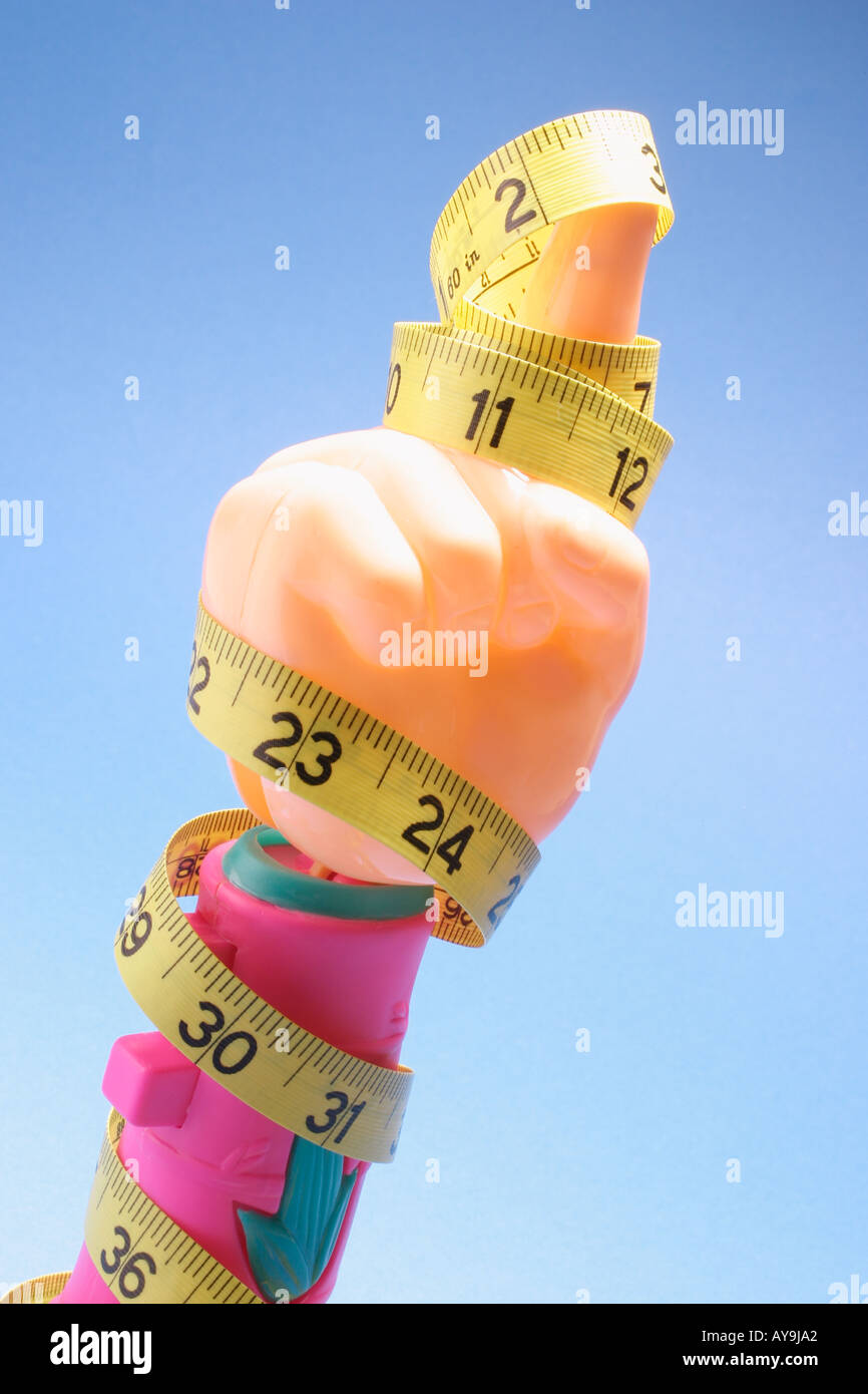 Tape Measure Wrap Around Toy Hand Stock Photo - Alamy