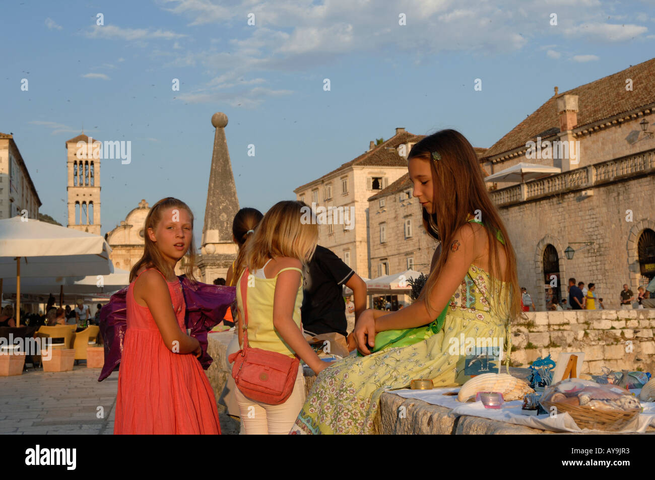 girls selling oceanic souvenirs Stock Photo - Alamy