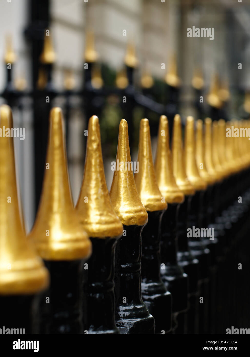 Traditional London architectural black street railing with gold painted ...