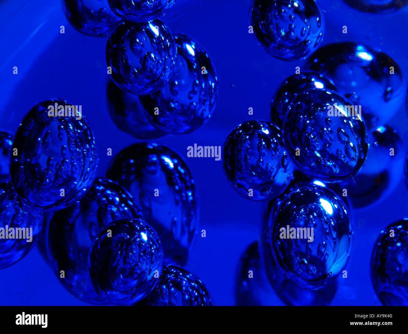 Blue bubbles in liquid glass Stock Photo - Alamy