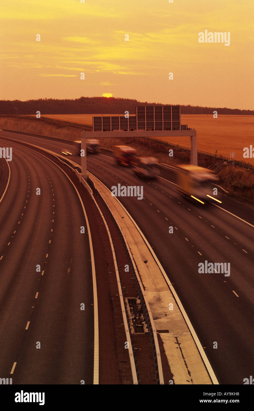traffic travelling on the A1/M motorway at sunset leeds uk Stock Photo ...
