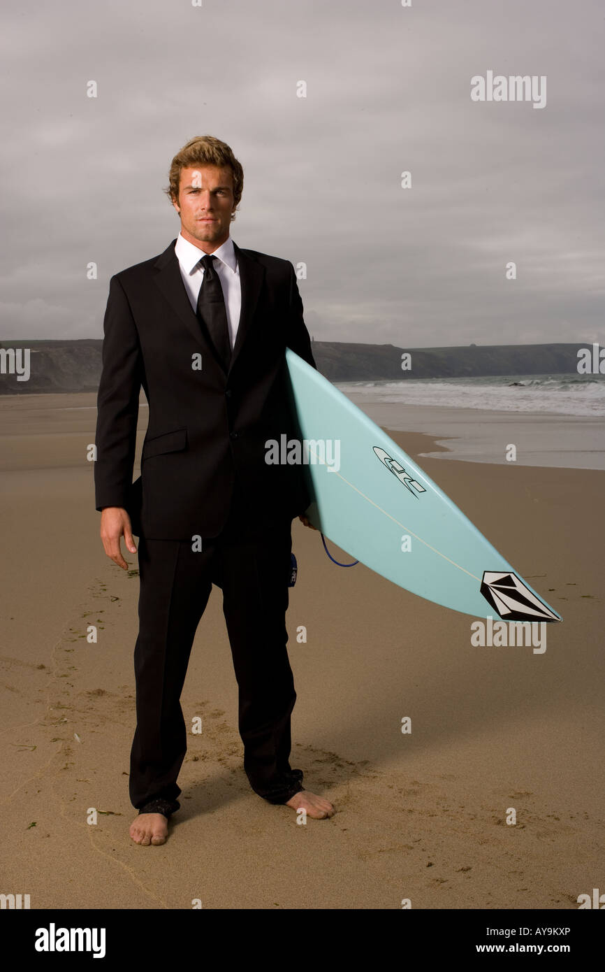 SURFER JOSS ASH SURFING IN A SUIT Stock Photo - Alamy