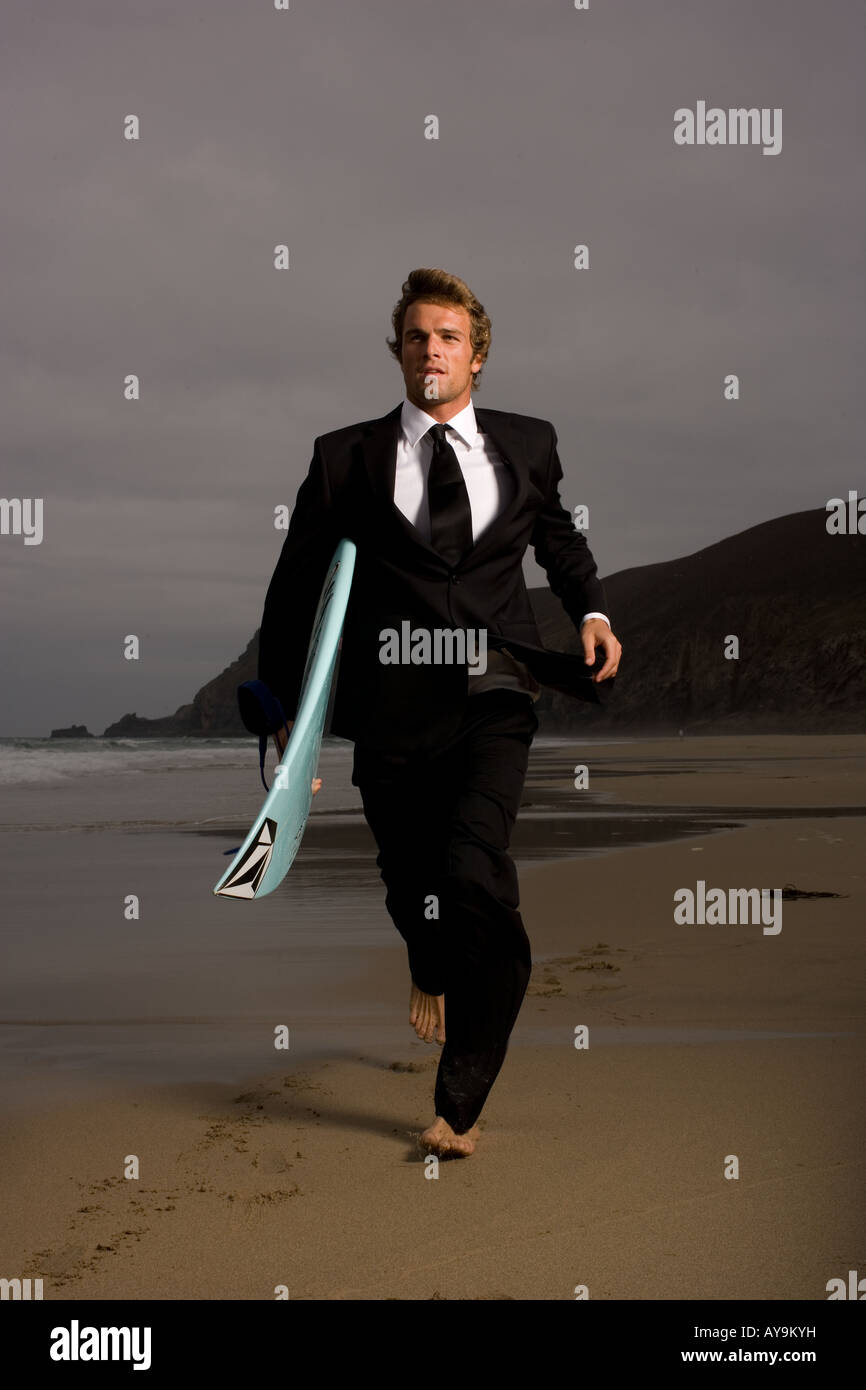 SURFER JOSS ASH SURFING IN A SUIT Stock Photo - Alamy
