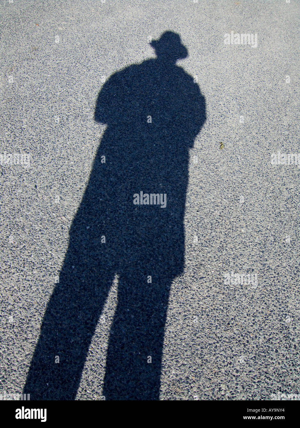 The shadow of a man wearing a hat Stock Photo - Alamy