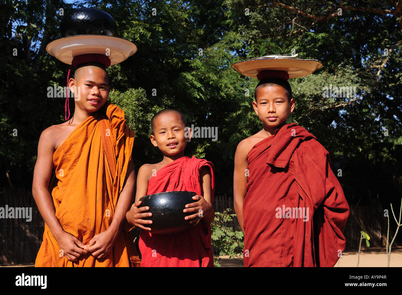 Burmese monks on his way home after collecting the daily food ration ...