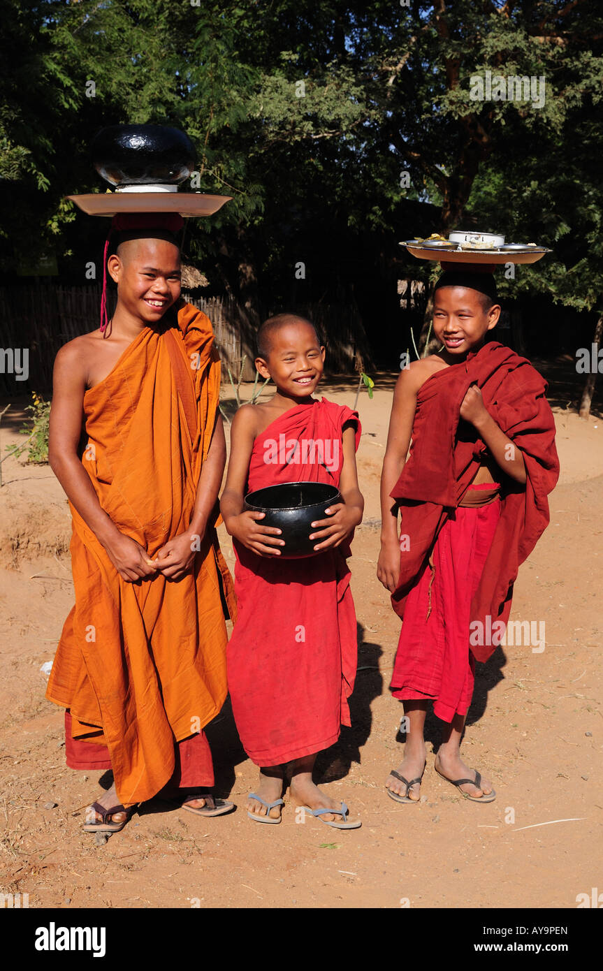 Burmese monks on his way home after collecting the daily food ration ...