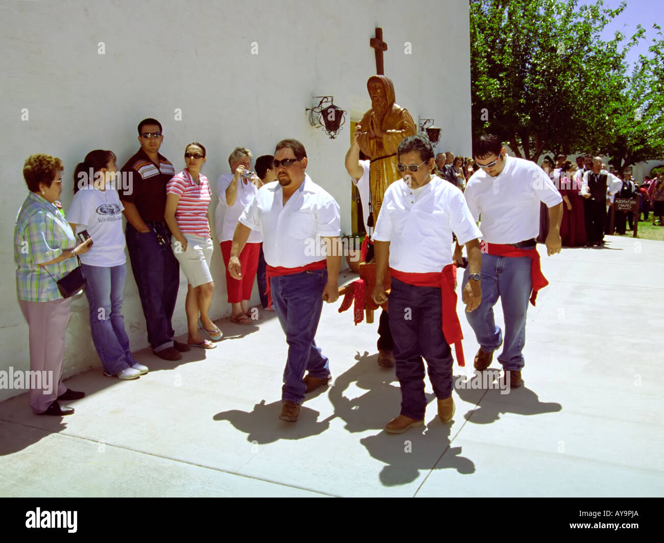 A hand-carved wood statue of Saint Francis of Assisi is carried to ...