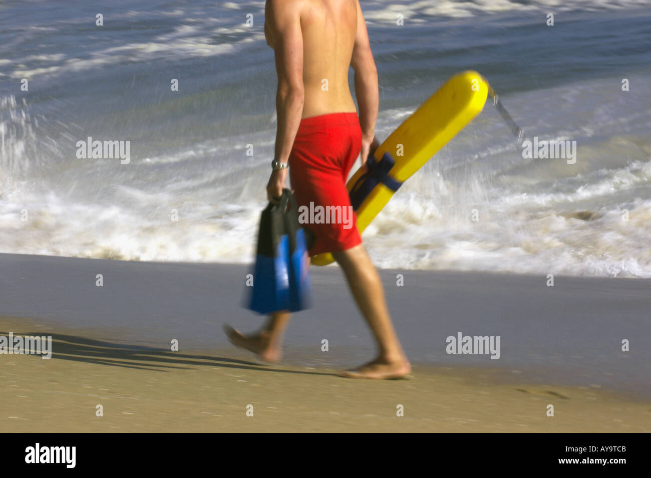 lifeguard with fins and flotation Stock Photo - Alamy
