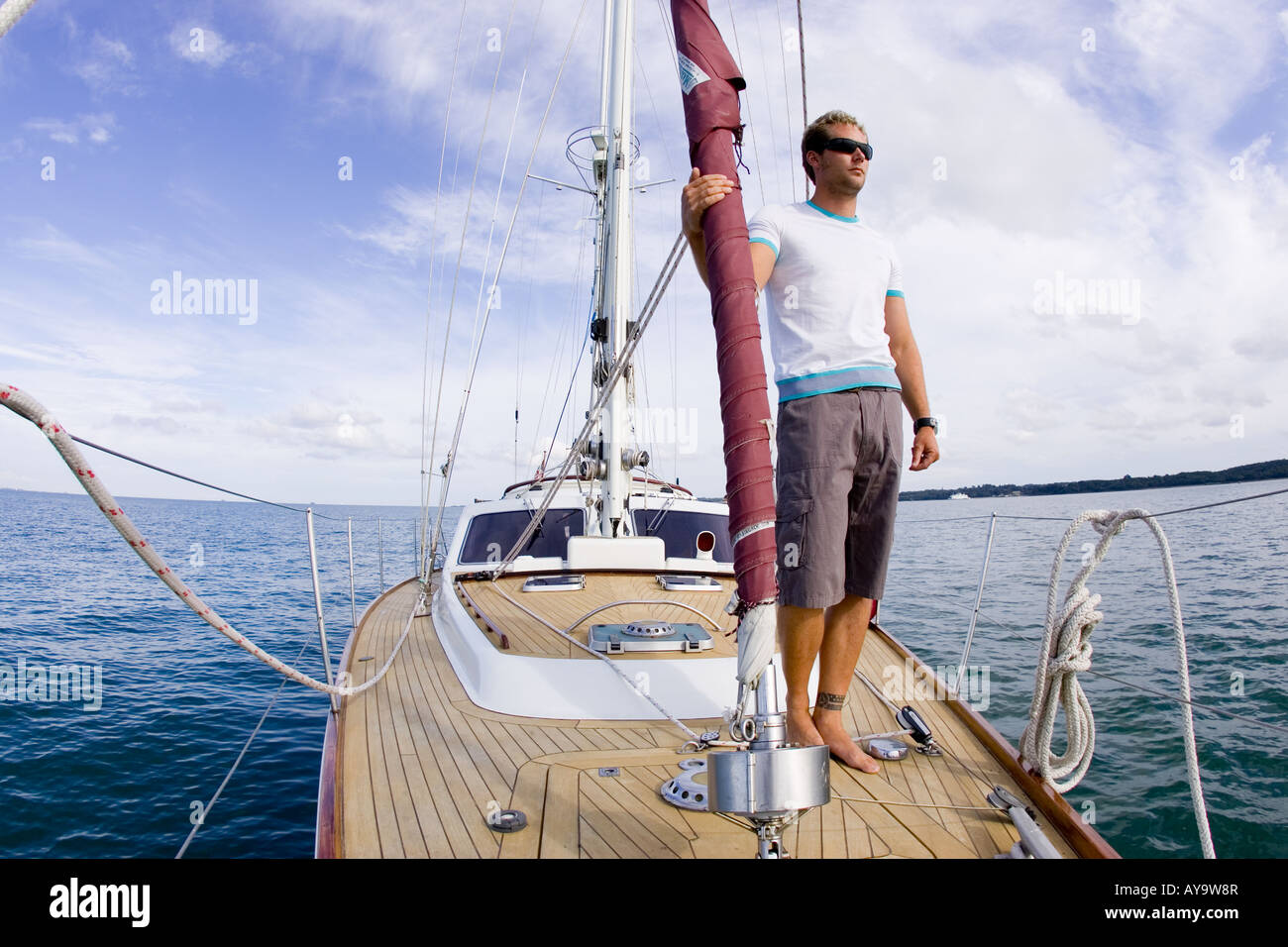 Person standing at front of sailing yacht hi-res stock photography and ...