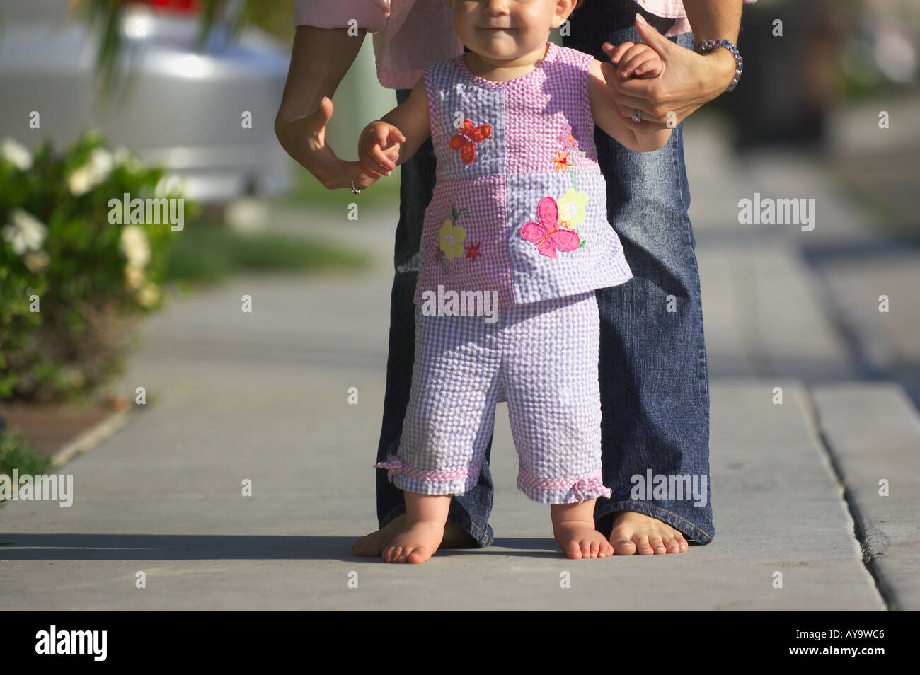mother and standing baby girl Stock Photo - Alamy