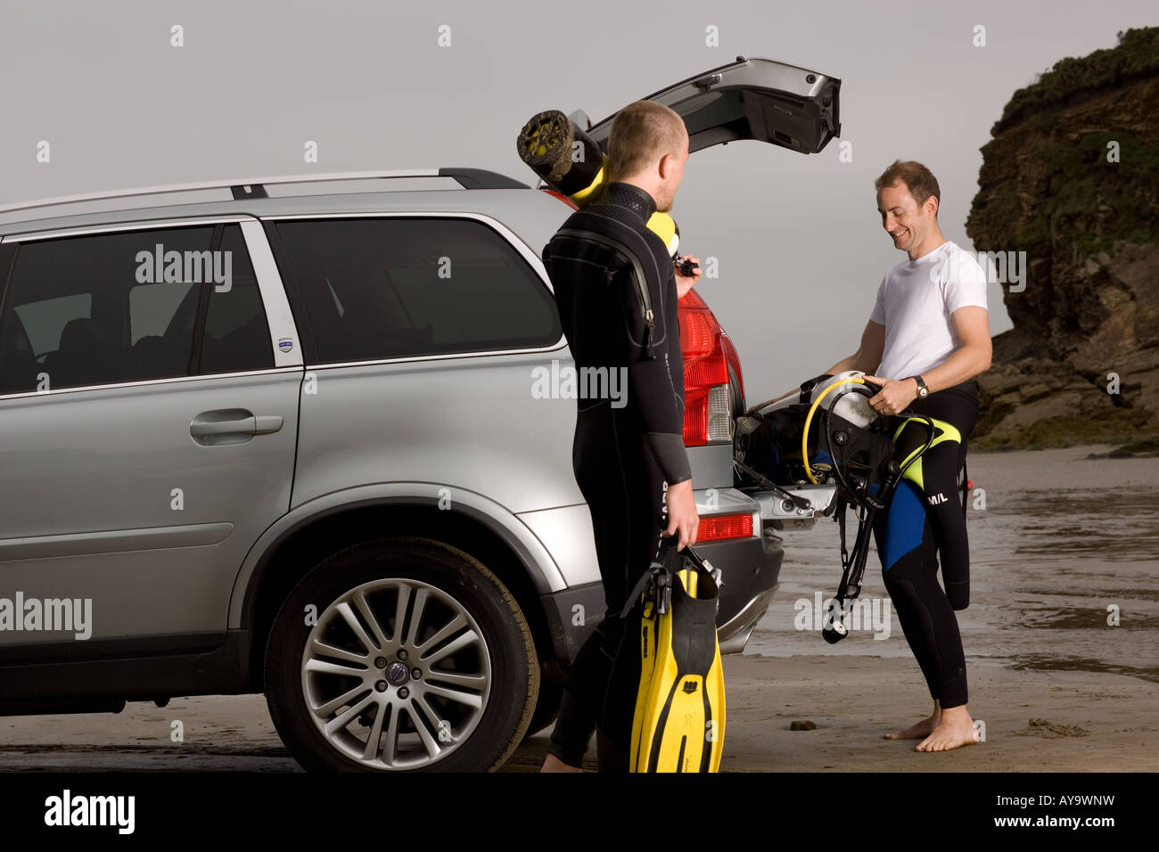 Scuba divers unloading car on beach in Pembrokeshire, Wales Stock Photo ...