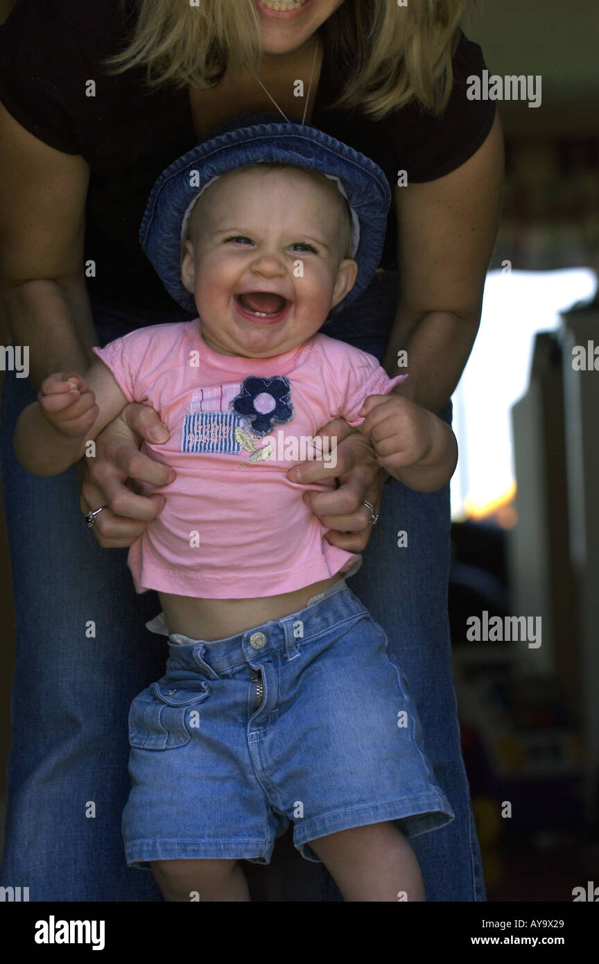 happy baby and mother standing together Stock Photo - Alamy