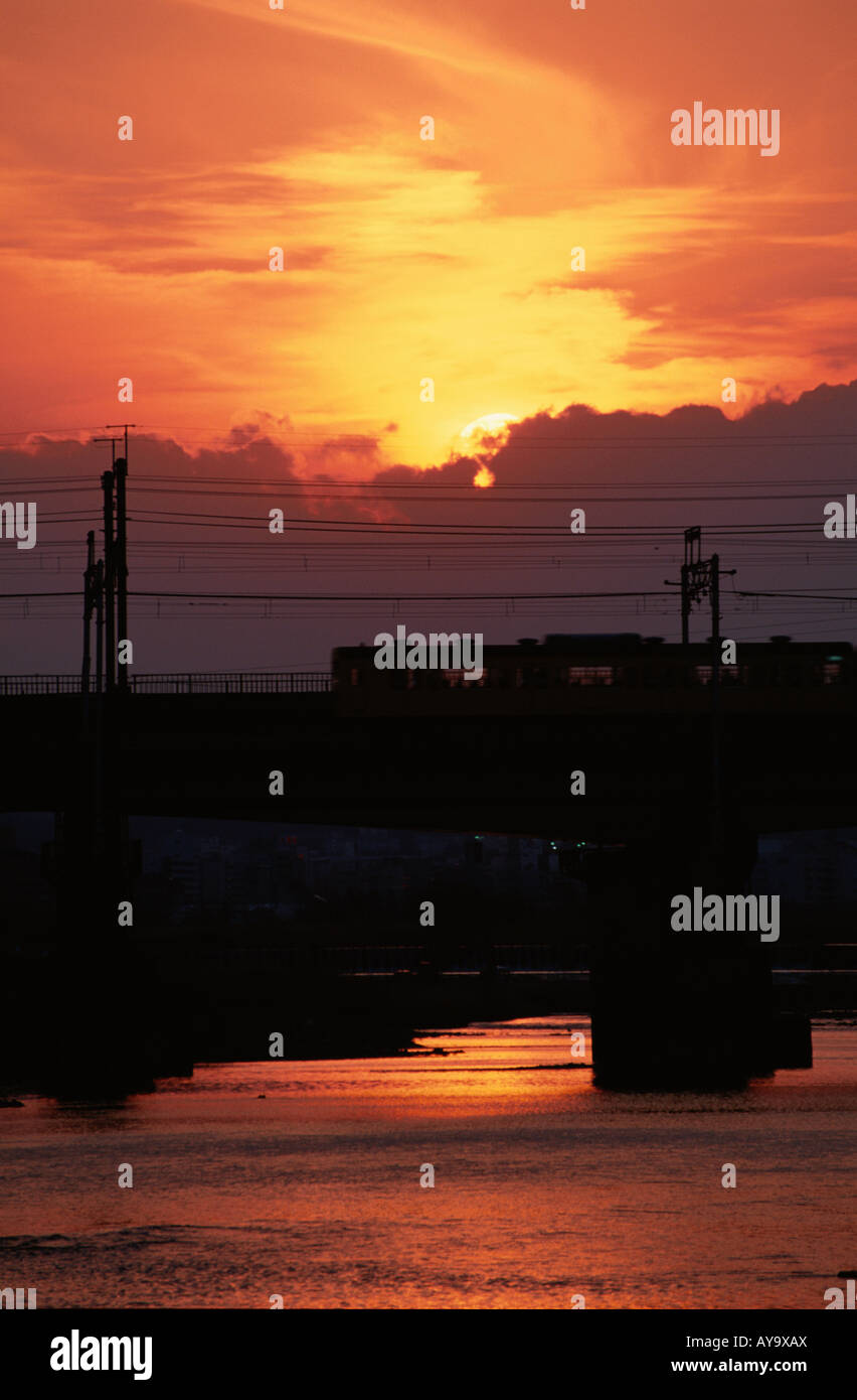 Train on Bridge in Sunset Stock Photo - Alamy