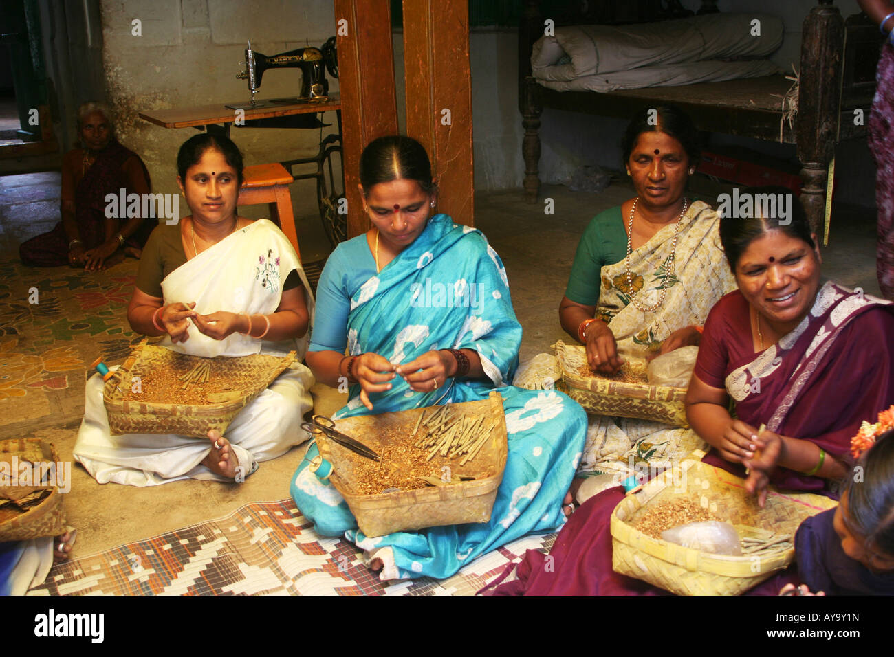 Women making Beedi - local cigarette Stock Photo - Alamy