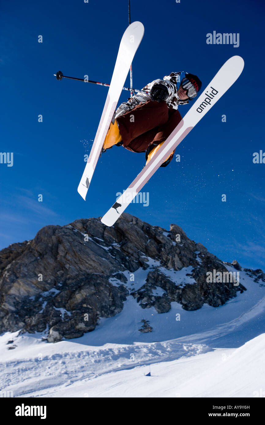 Skier jump mid air snow mountain action hi-res stock photography and ...