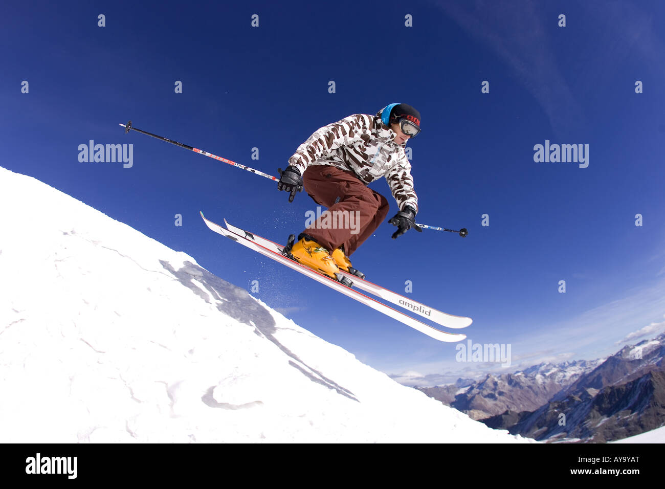 Skier in mid air on mountain slope, Tignes, France Stock Photo - Alamy