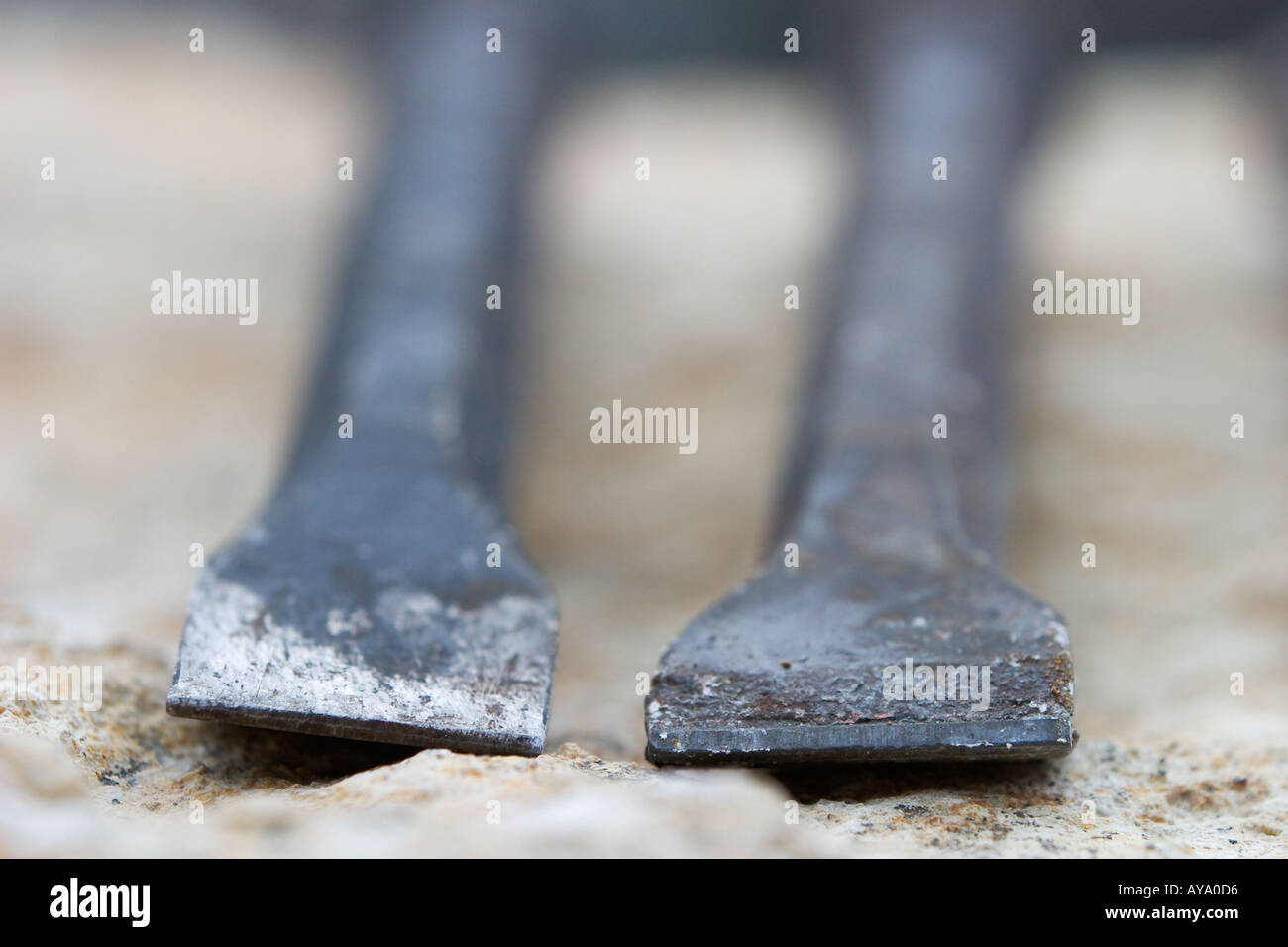 Detail from the sharp edge of two used black chisel Stock Photo - Alamy