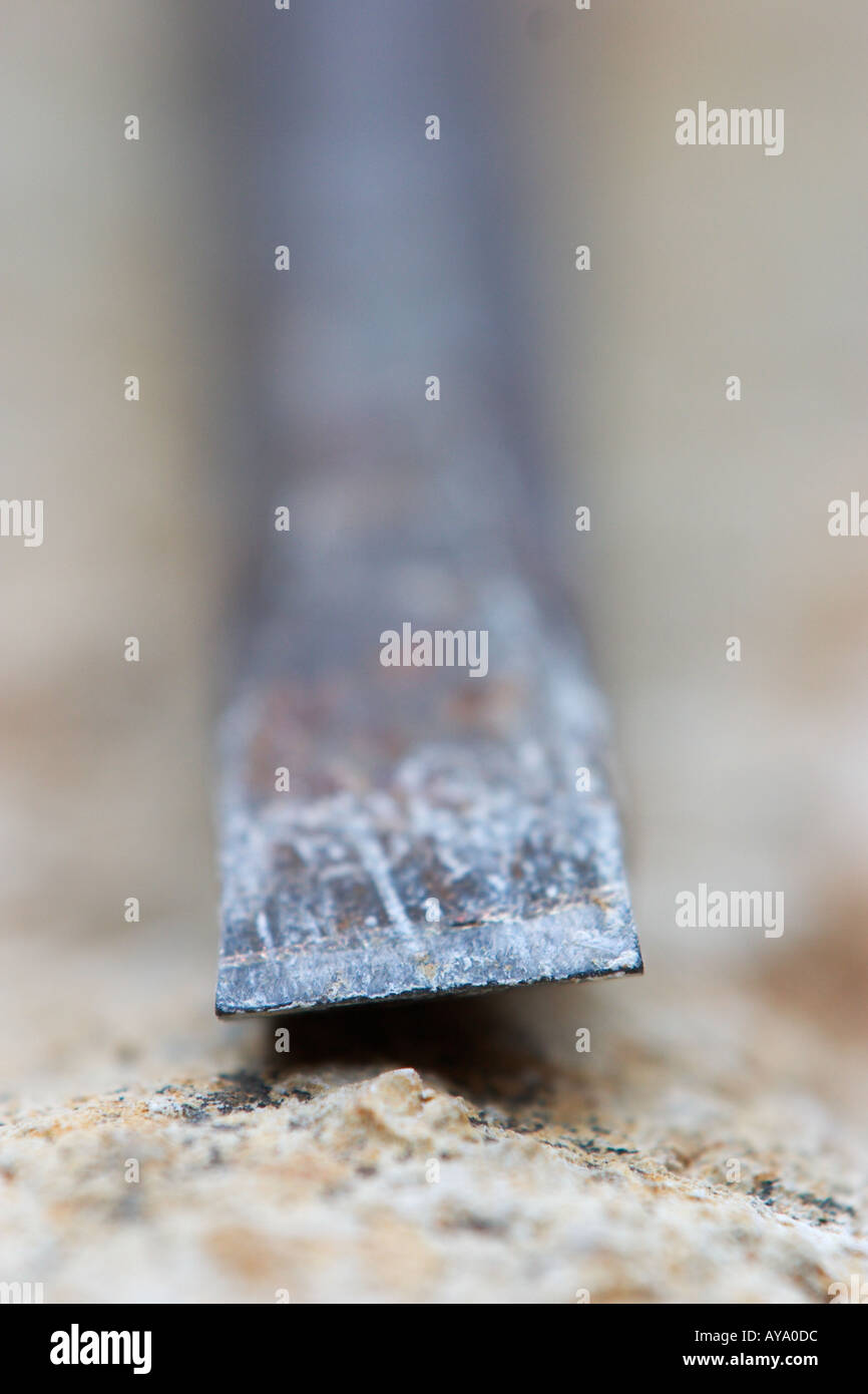 Detail from the sharp edge of a used black chisel Stock Photo - Alamy