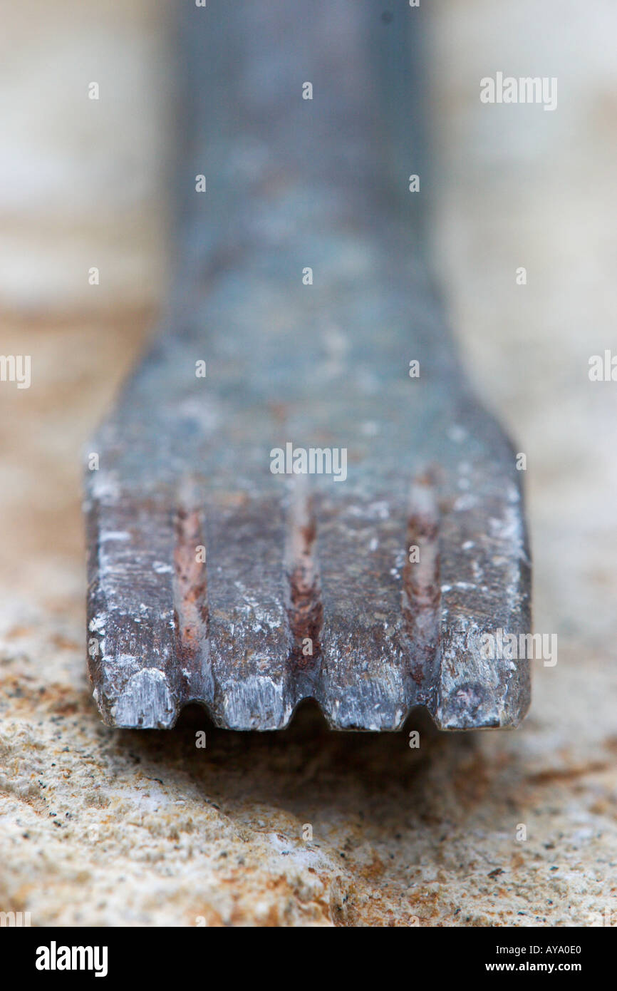 Detail from the sharp edge of a used black chisel Stock Photo - Alamy