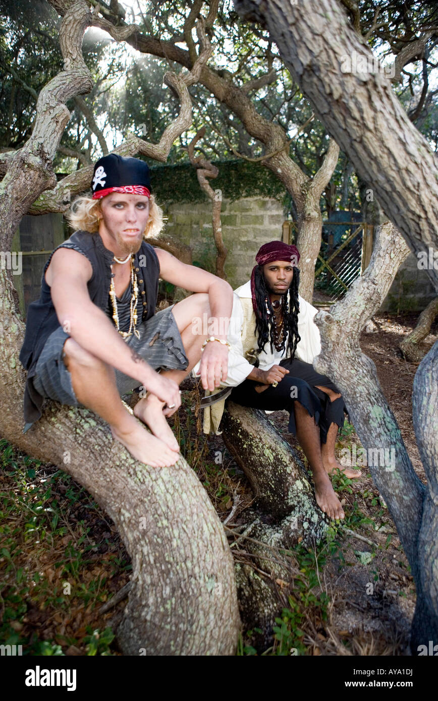 Portrait of pirates sitting on tree trunks Stock Photo - Alamy