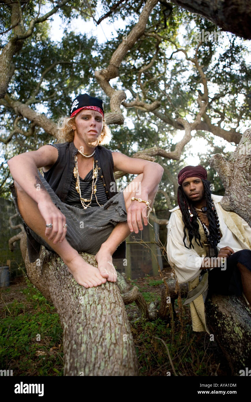 Portrait of pirates sitting on tree trunks Stock Photo - Alamy