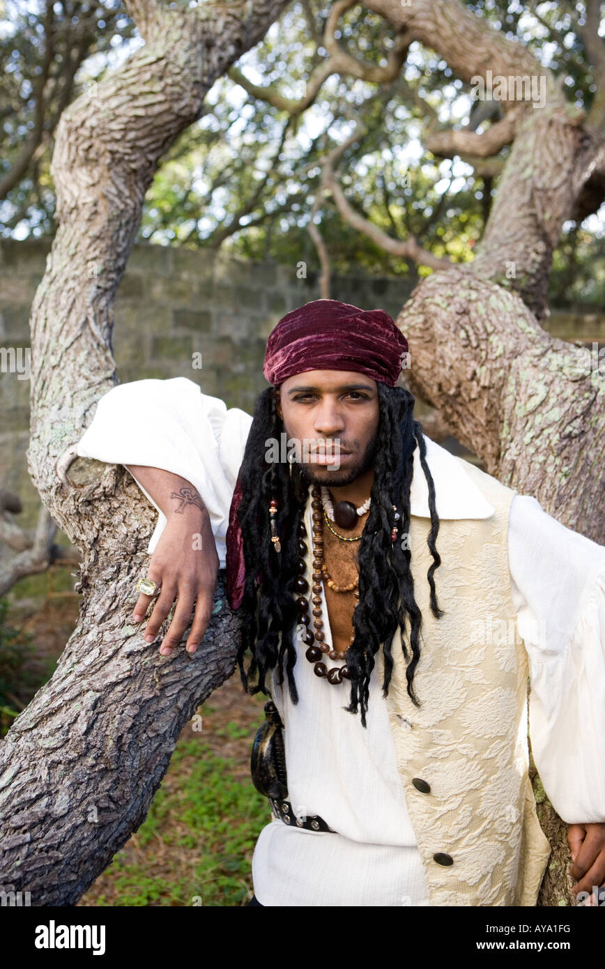 Portrait of a pirate standing under trees Stock Photo - Alamy