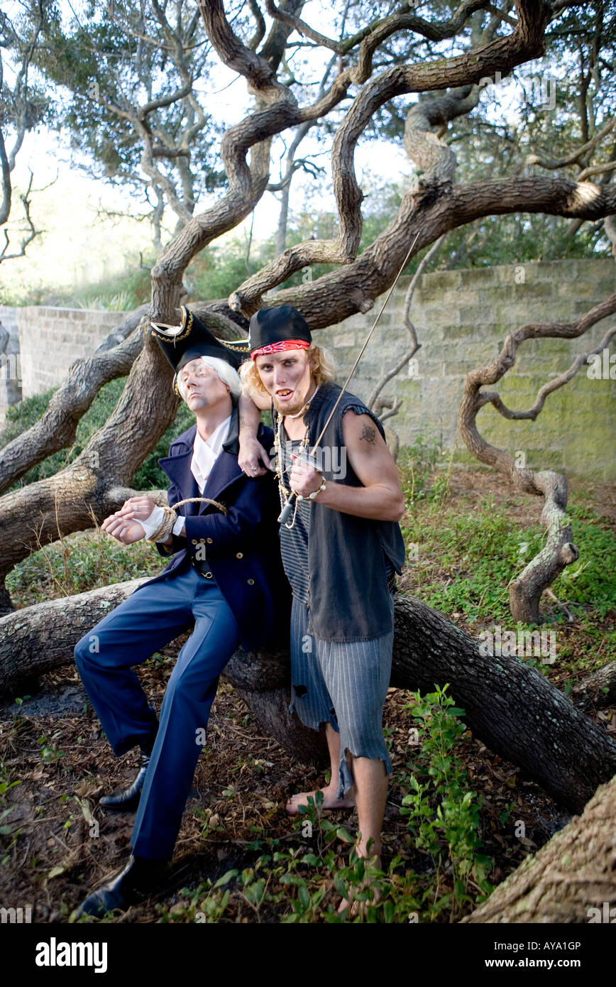 Armed pirate holding a navy officer as hostage and threatening him with ...