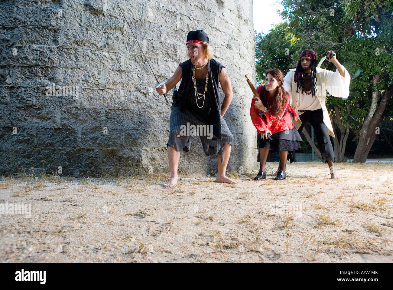 View of armed pirates sneaking around a castle wall Stock Photo - Alamy