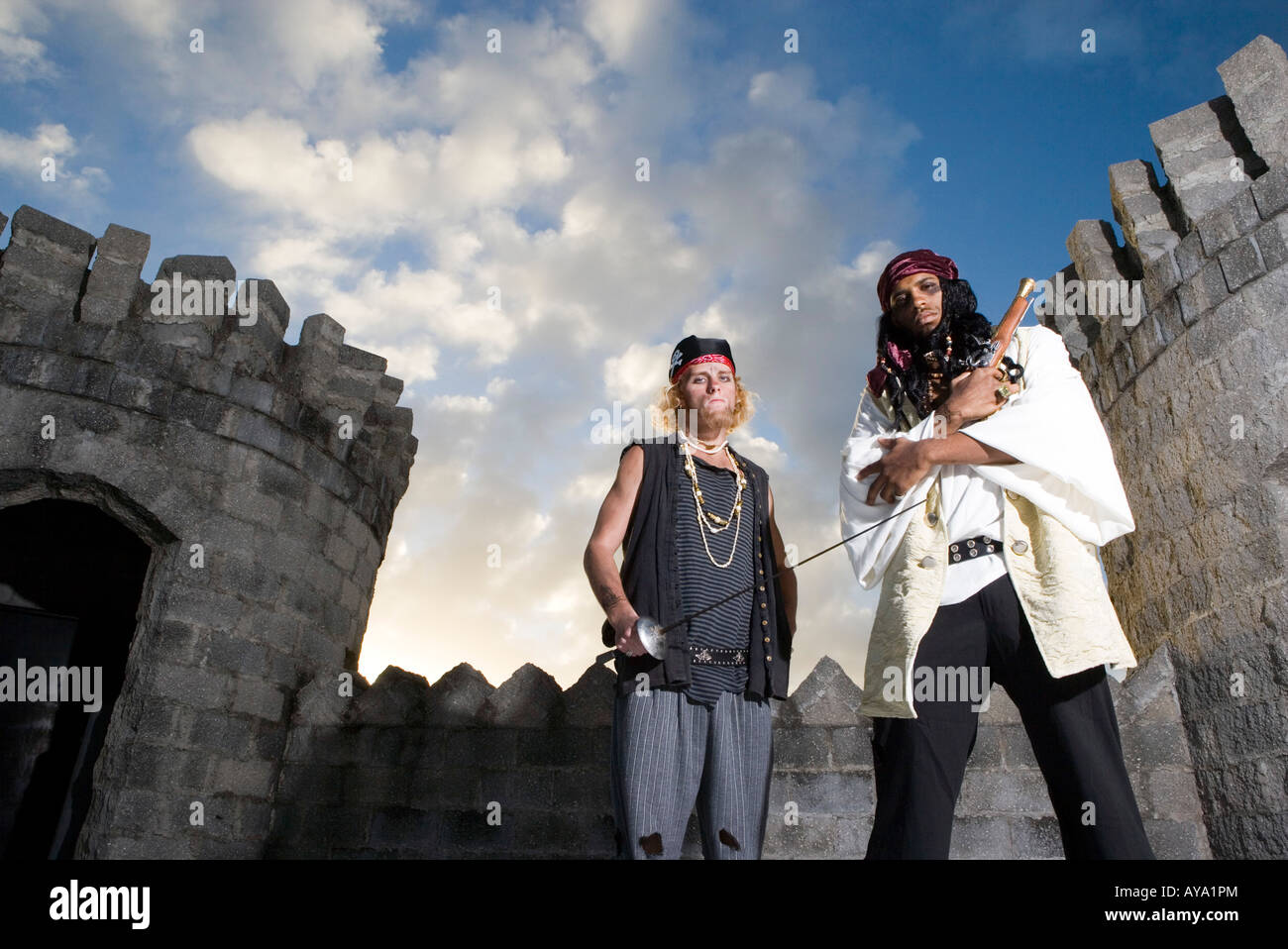 Portrait of pirates armed with a pistol and a sword with castle turrets ...