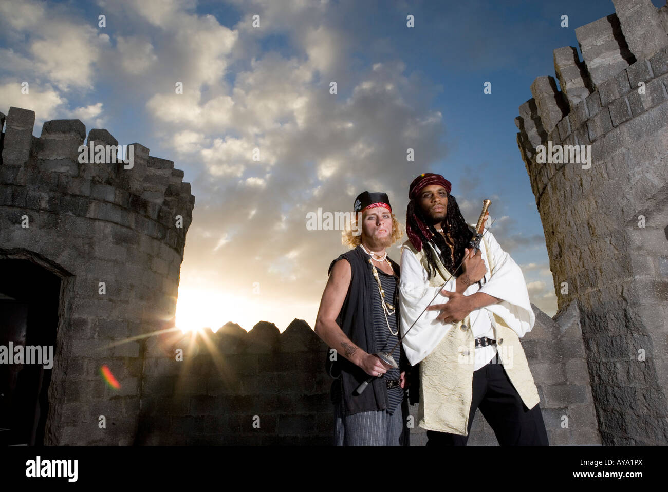 Portrait of pirates armed with a pistol and a sword with castle turrets ...