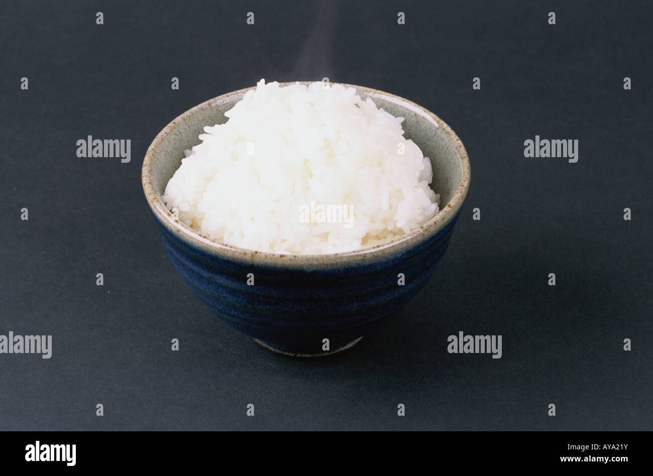 Bowl of Steaming Rice Stock Photo - Alamy