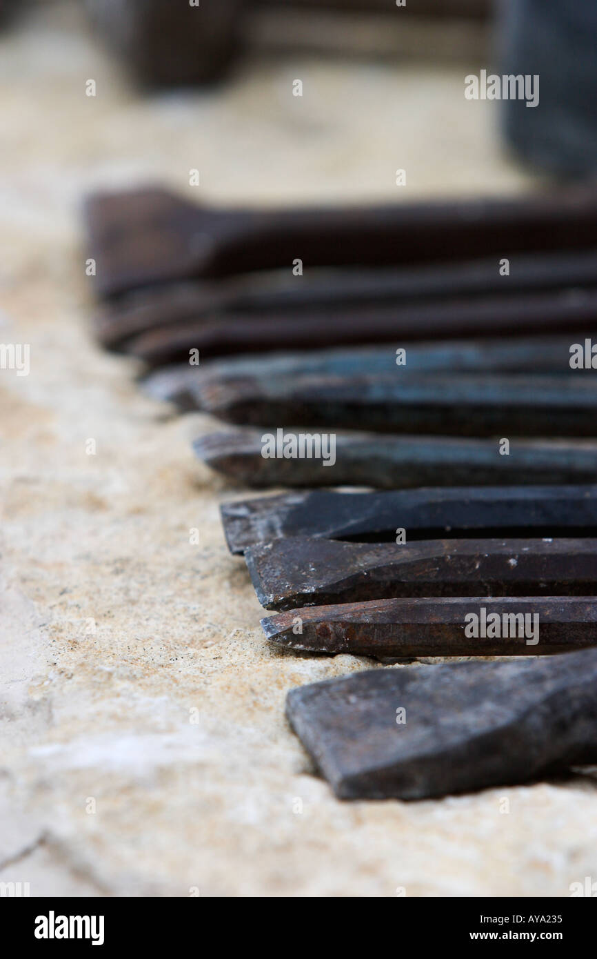 Tools from a hewer Lined up black chisel Stock Photo - Alamy