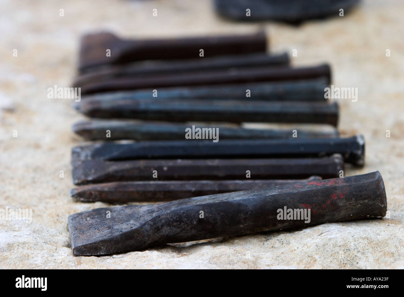 Tools from a hewer Lined up black chisel Stock Photo - Alamy