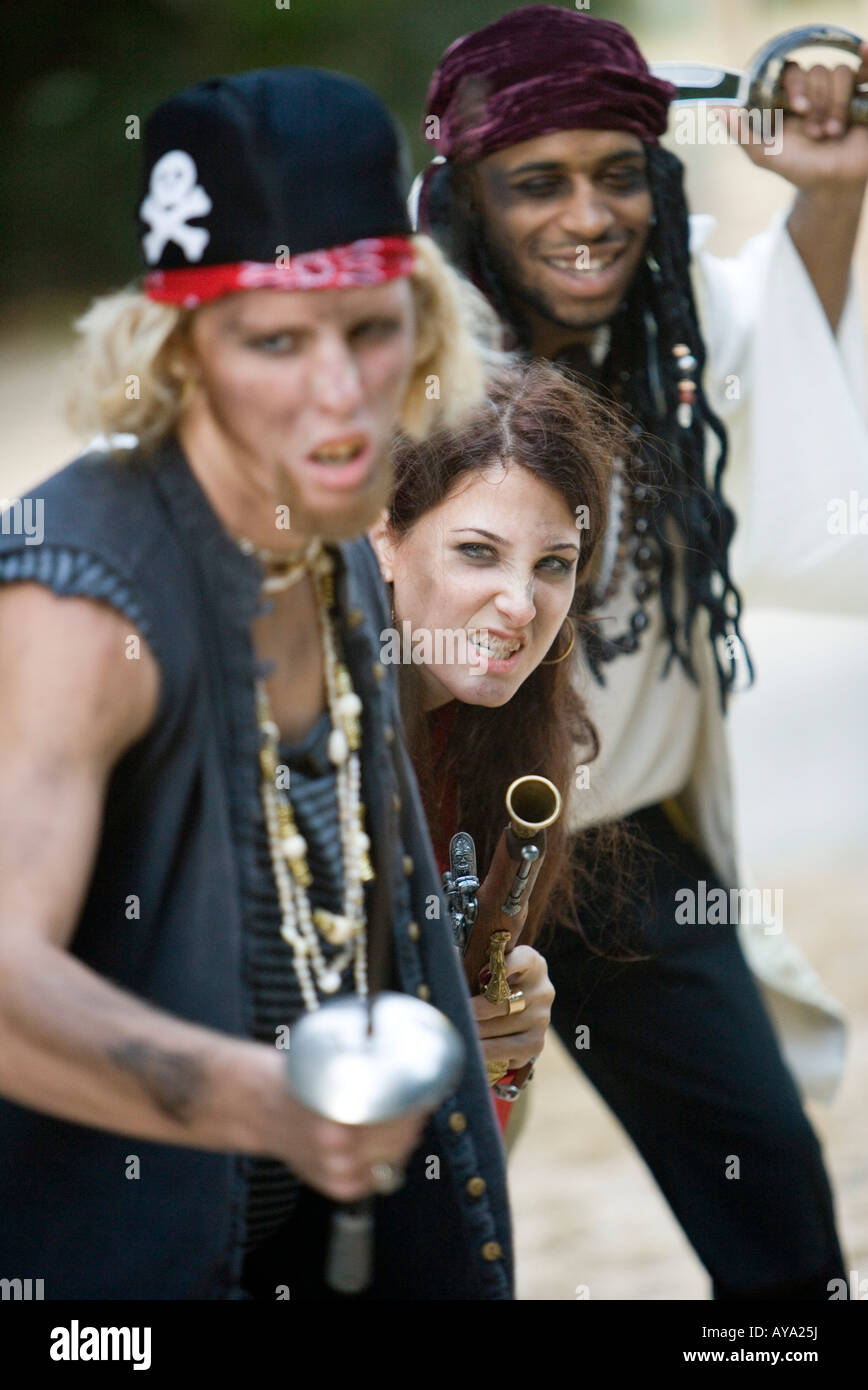View of pirates armed with a gun and swords Stock Photo - Alamy