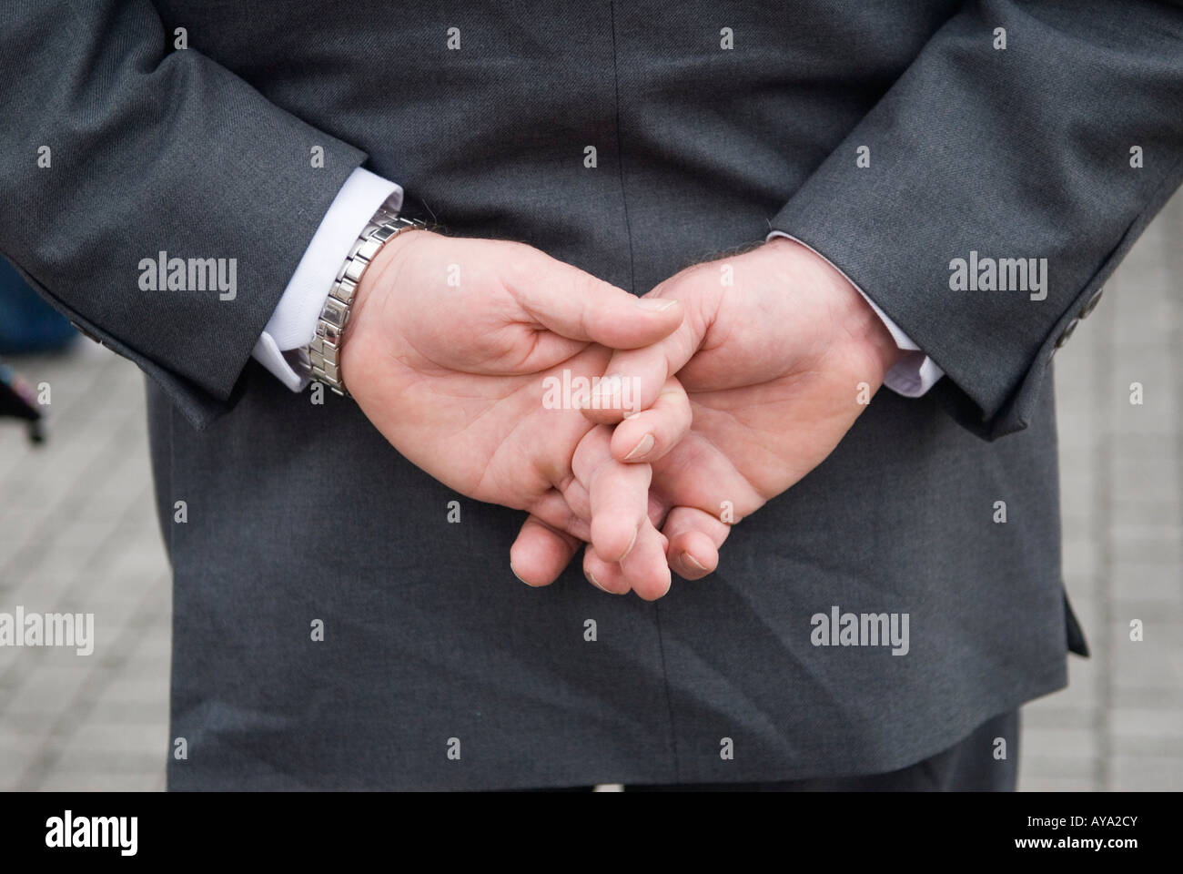Hands clasped behind back hi-res stock photography and images - Alamy