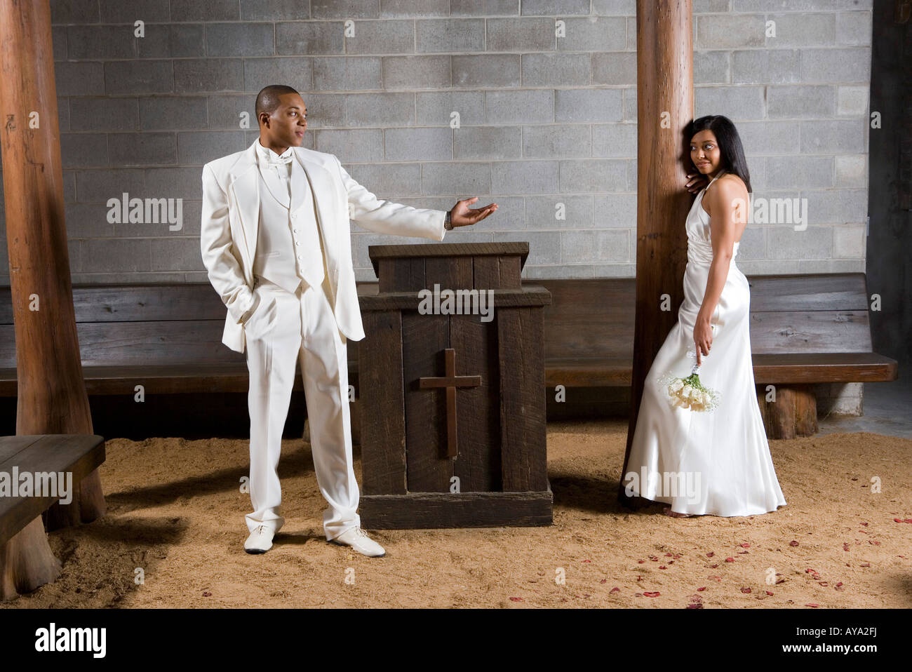A bride and a groom next to an altar inside a medieval castle Stock ...