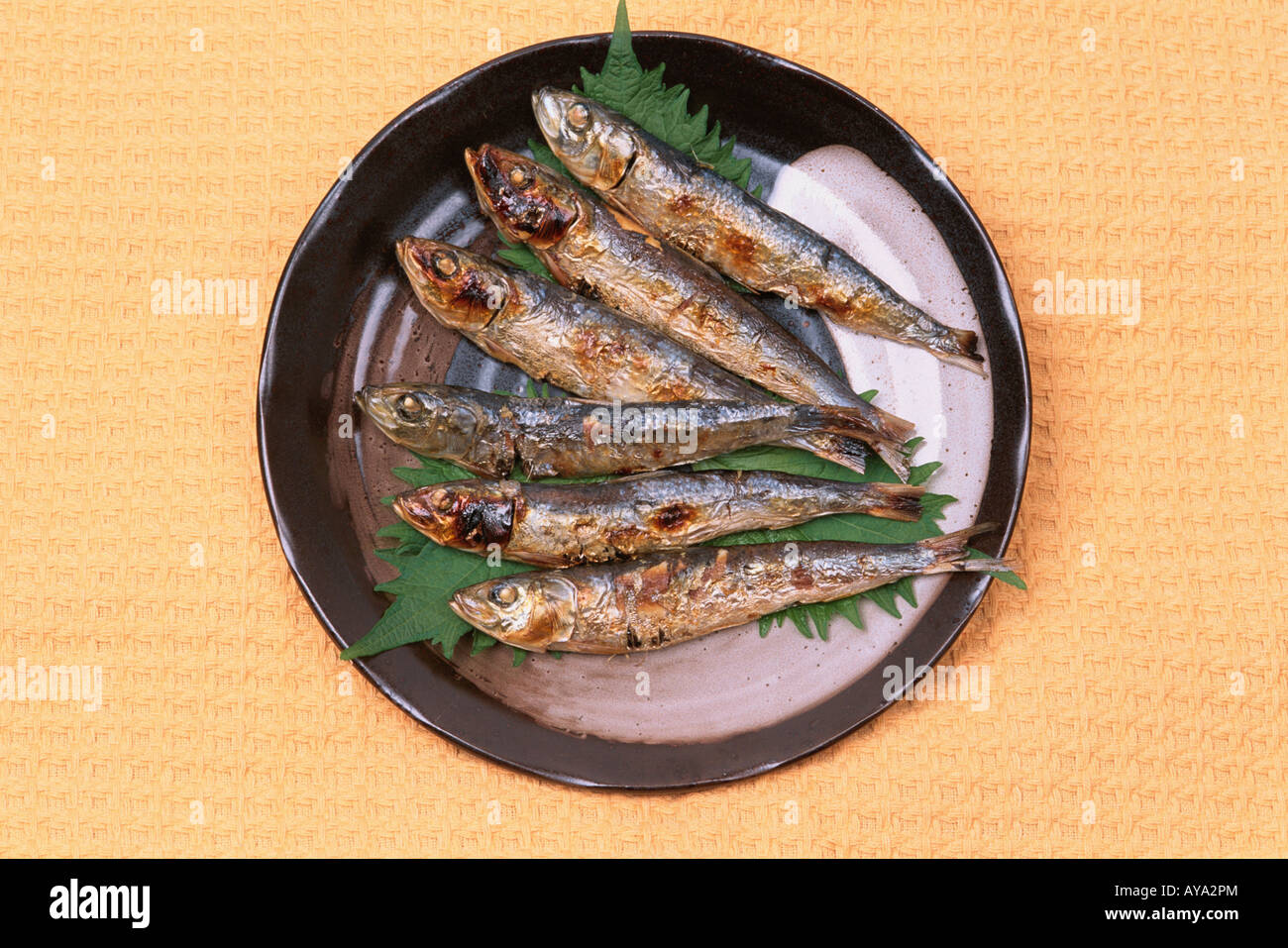Baked Sardines on Plate Stock Photo - Alamy