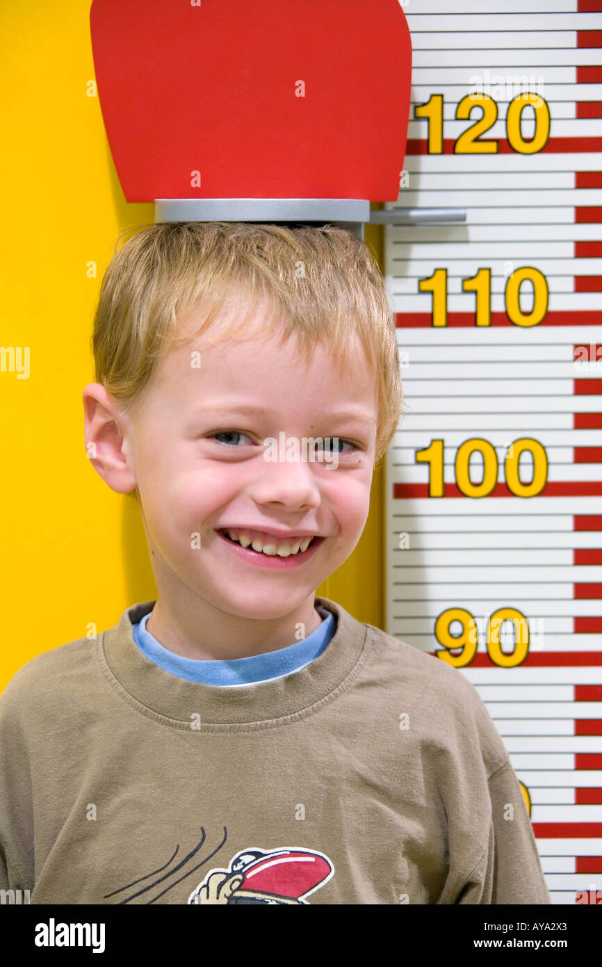 A four year old boy in front of a big ruler Stock Photo - Alamy