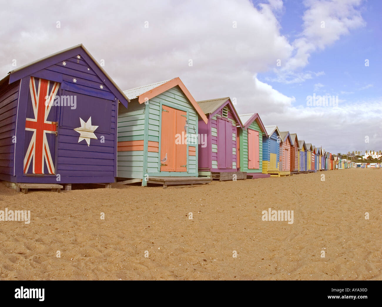 Row of brightly painted bathing huts on Brighton beach Melbourne ...