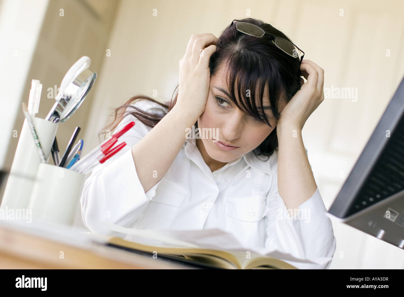 Frustrated woman using computer Stock Photo - Alamy